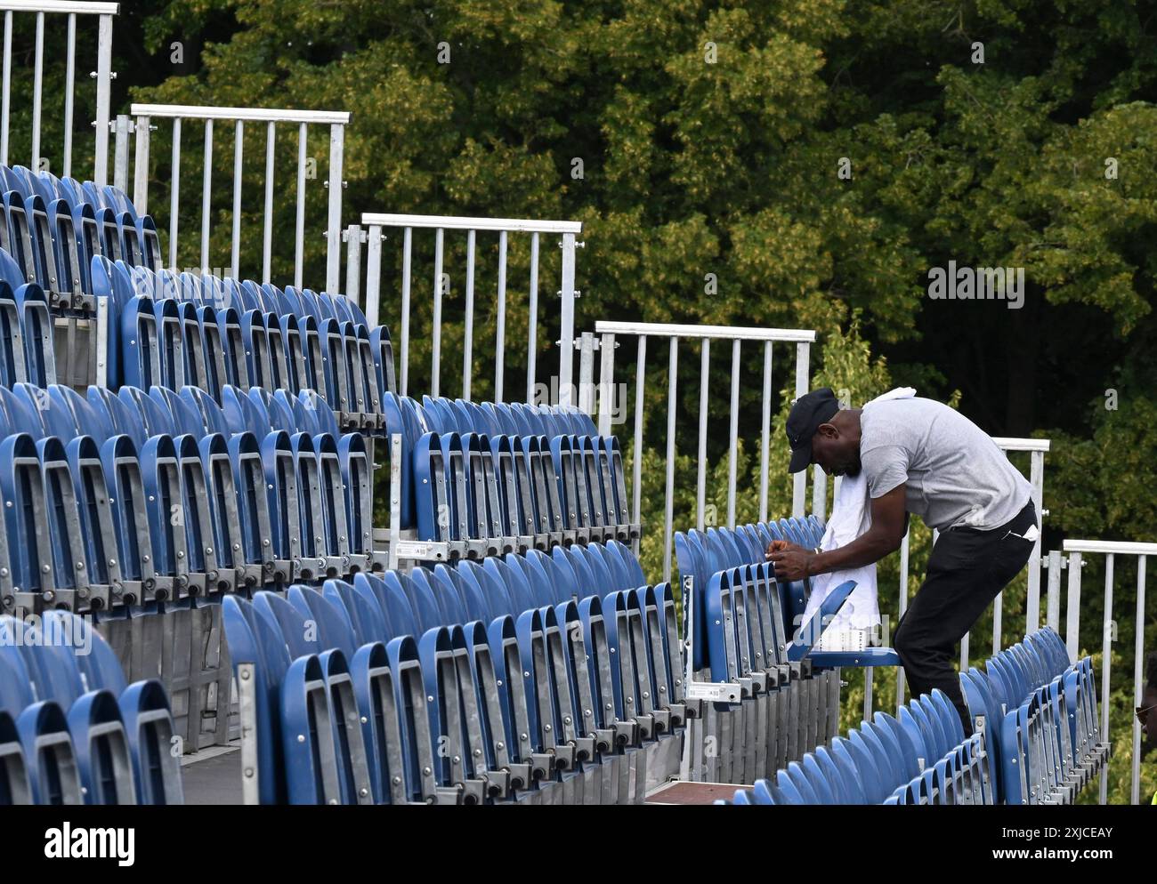Paris, France. 17th July, 2024. A staff member labels seats in the ...
