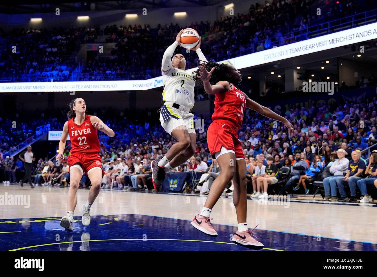 Dallas Wings' Odyssey Sims (2) shoots as Indiana Fever's Caitlin Clark ...