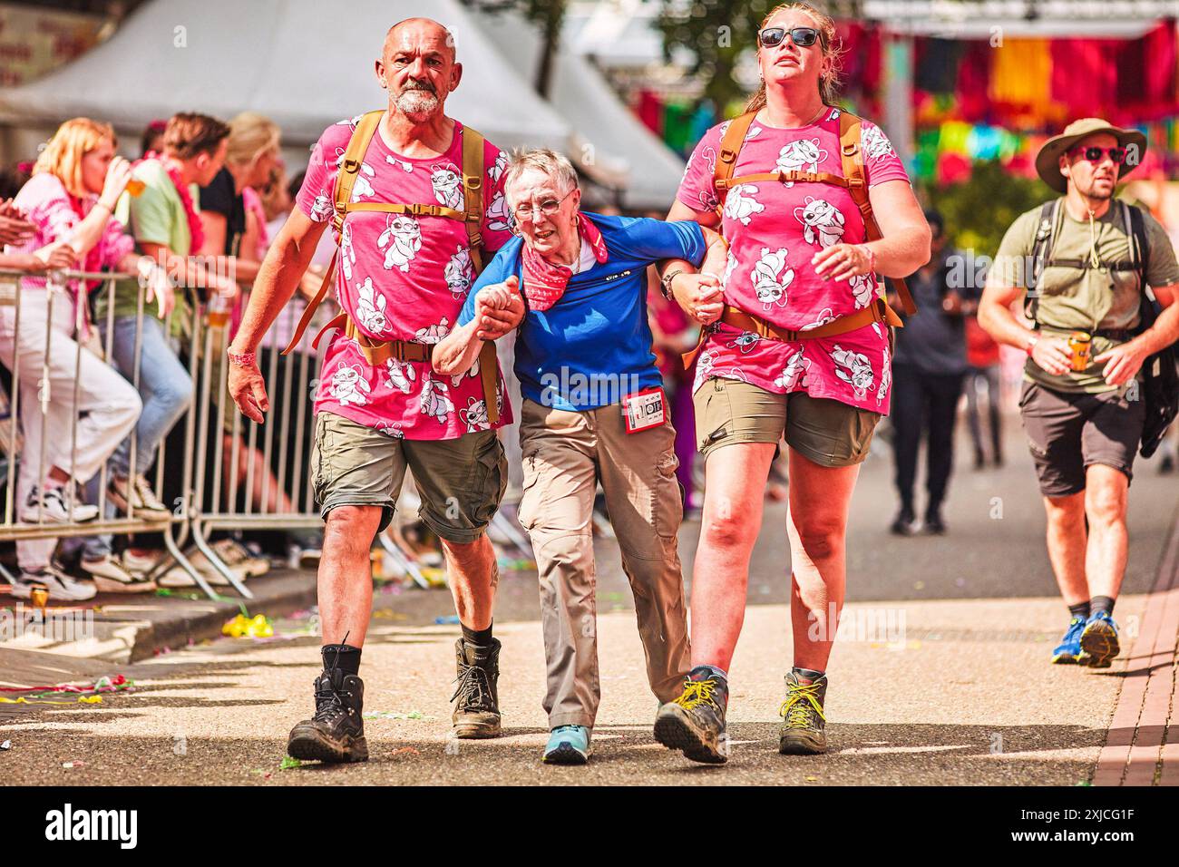Nijmegen, Netherlands. 17th July, 2024. Supported by 2 other walkers, a ...