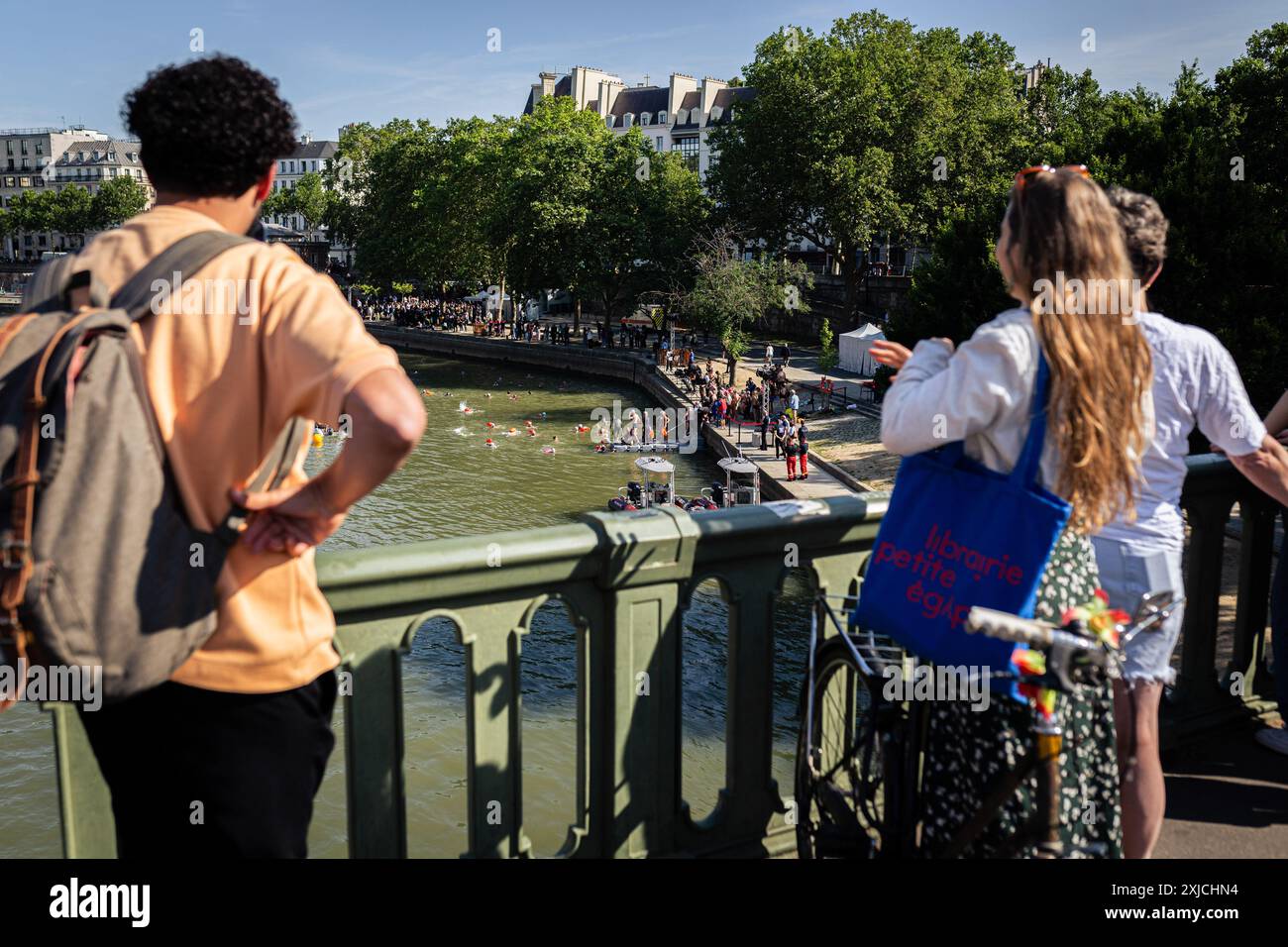 People gather on the Sully Bridge to watch the Mayor of Paris, Anne ...