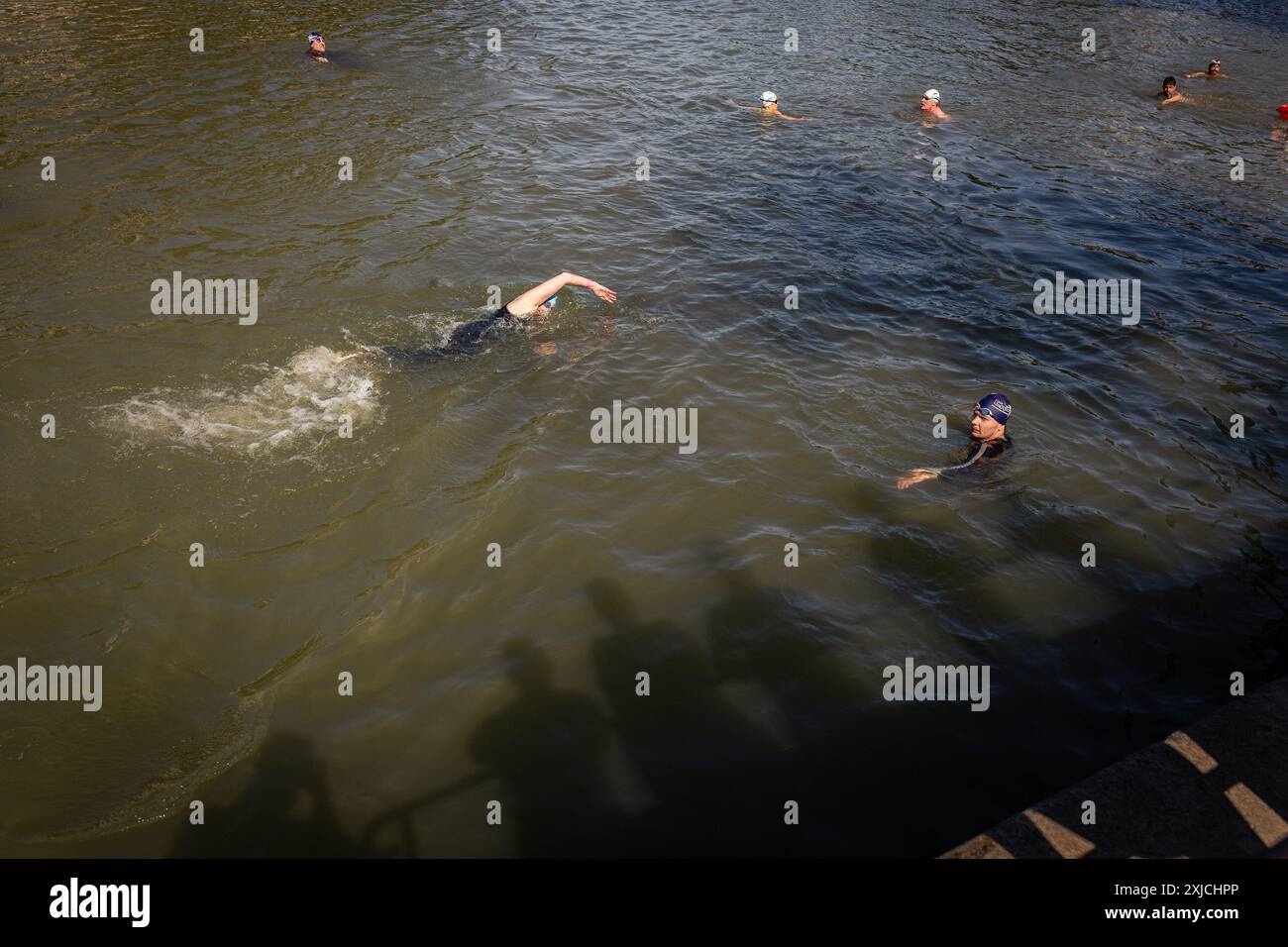 Paris, France. 17th July, 2024. People swim in the River Seine after ...