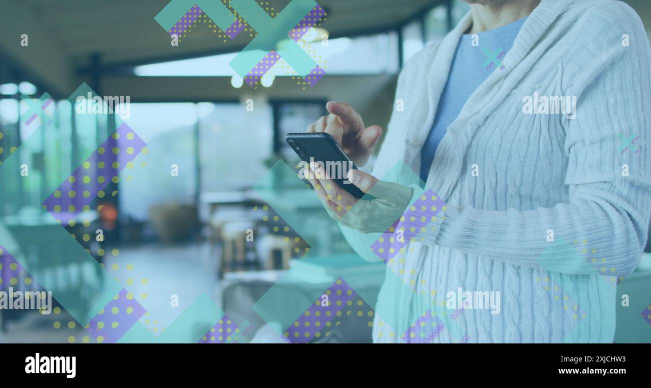 Image of x symbols over midsection of caucasian woman standing and ...