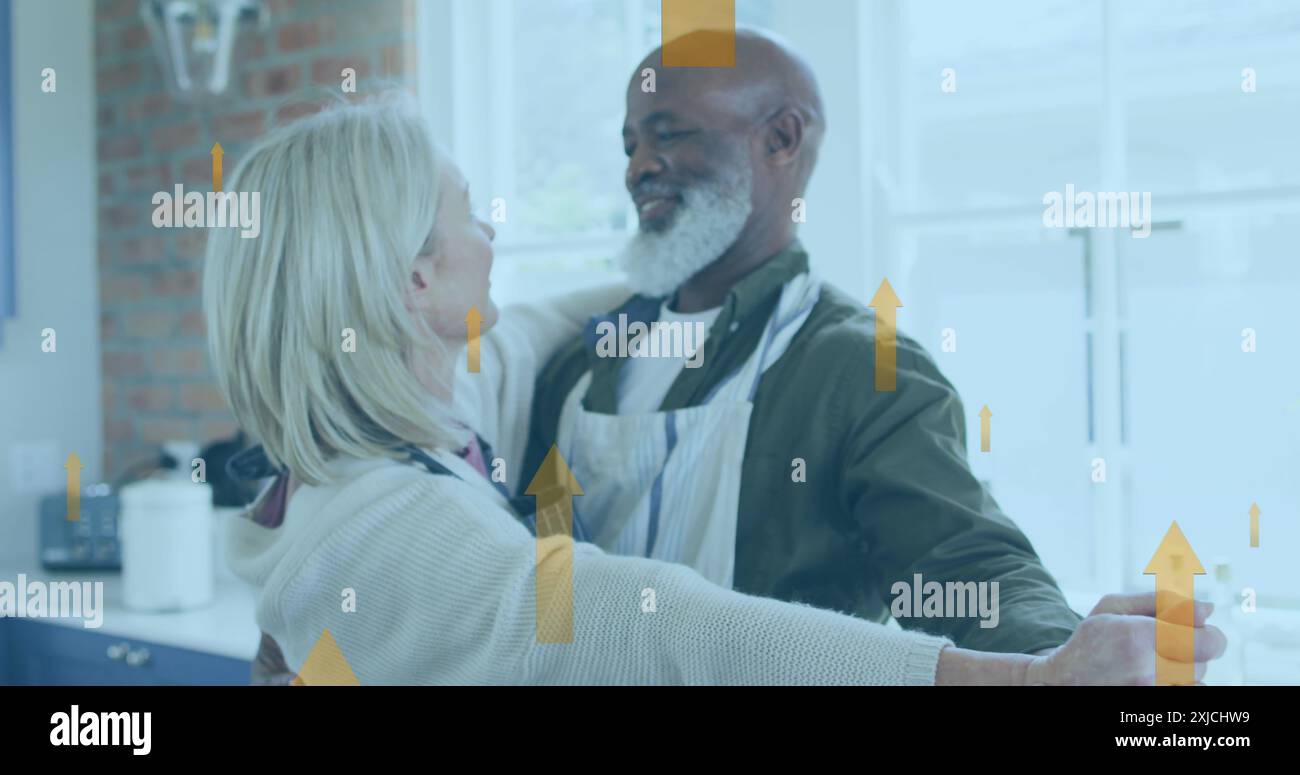 Image of multiple up arrow over diverse couple dancing wearing apron at ...