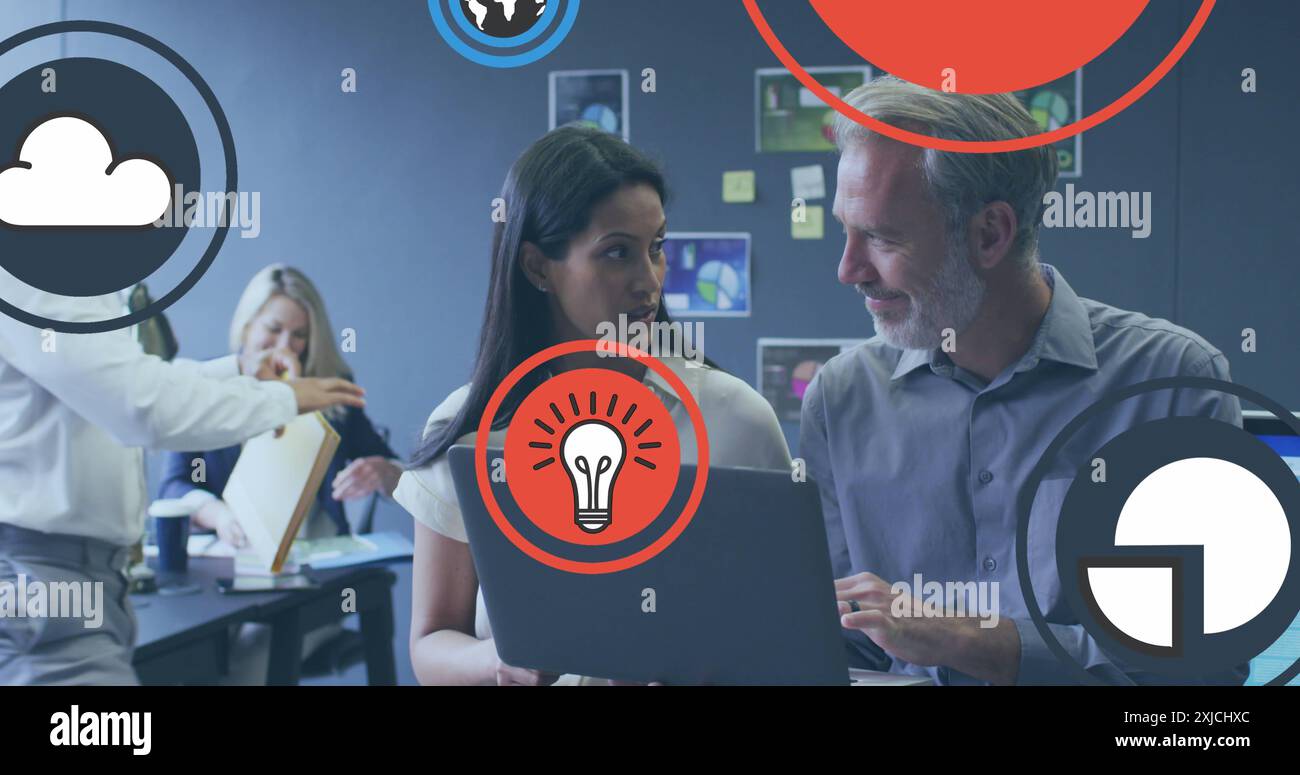 Image of icon in circles over diverse coworkers standing and discussing ...