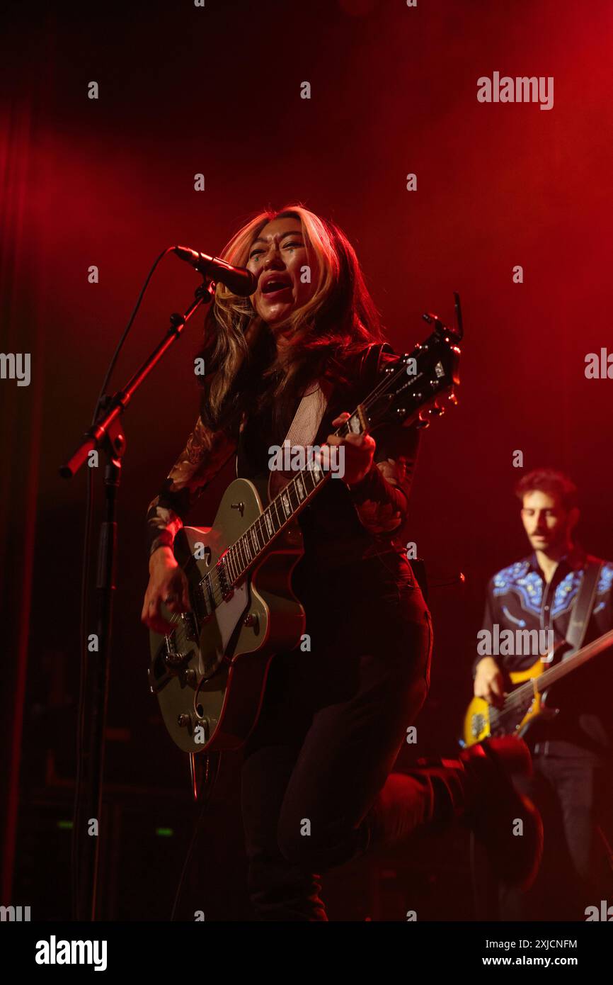 Kate Pillsbury of The Crane Wives plays guitar and sings live on stage ...