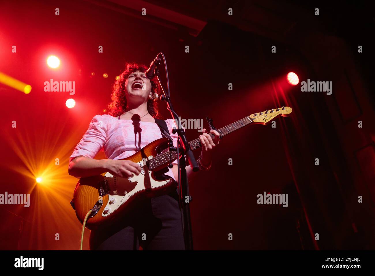 Kate Pillsbury of The Crane Wives plays guitar and sings live on stage ...