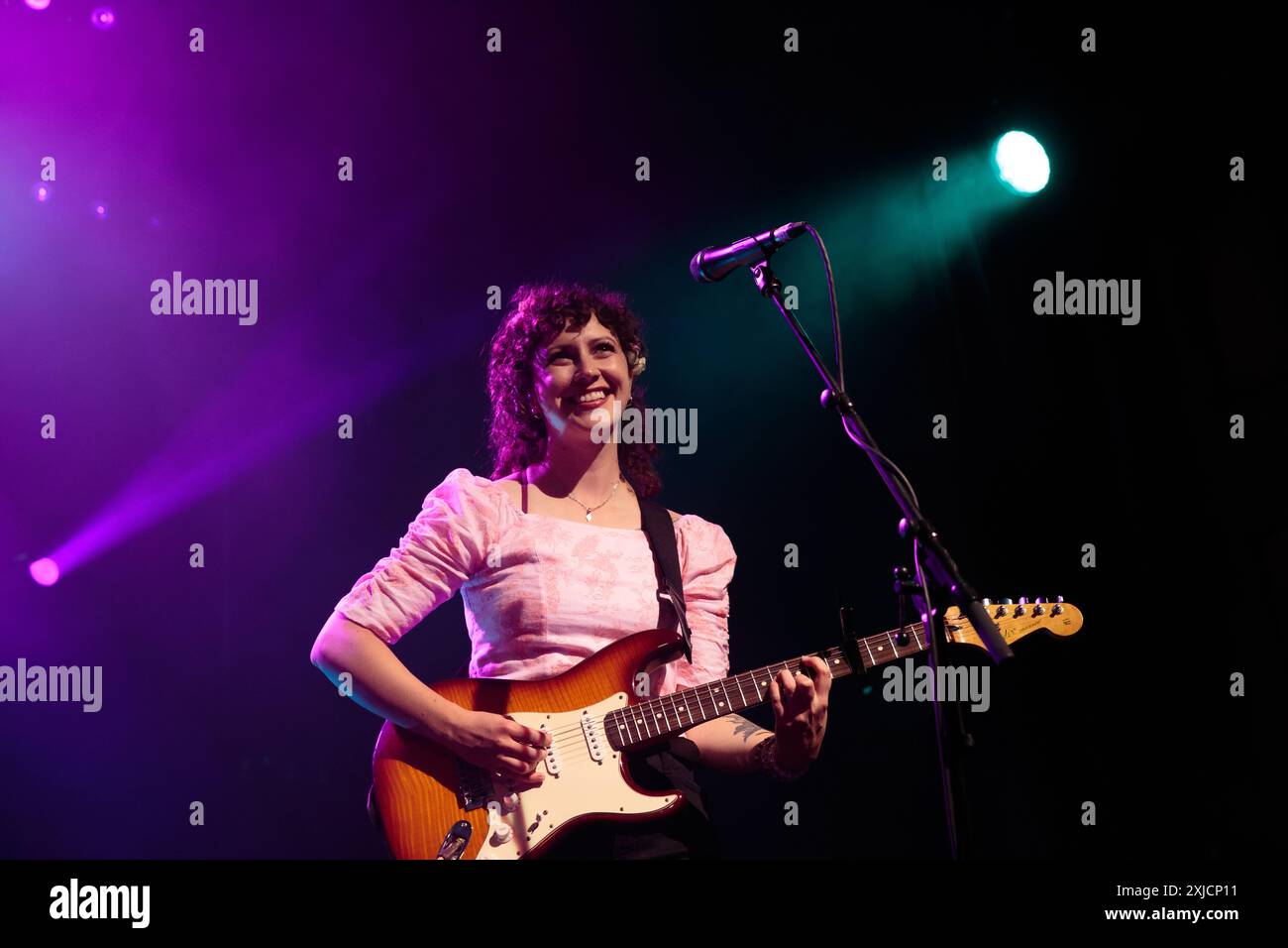 Kate Pillsbury of The Crane Wives plays guitar and sings live on stage ...