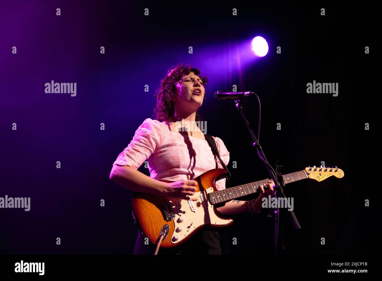 Kate Pillsbury of The Crane Wives plays guitar and sings live on stage ...