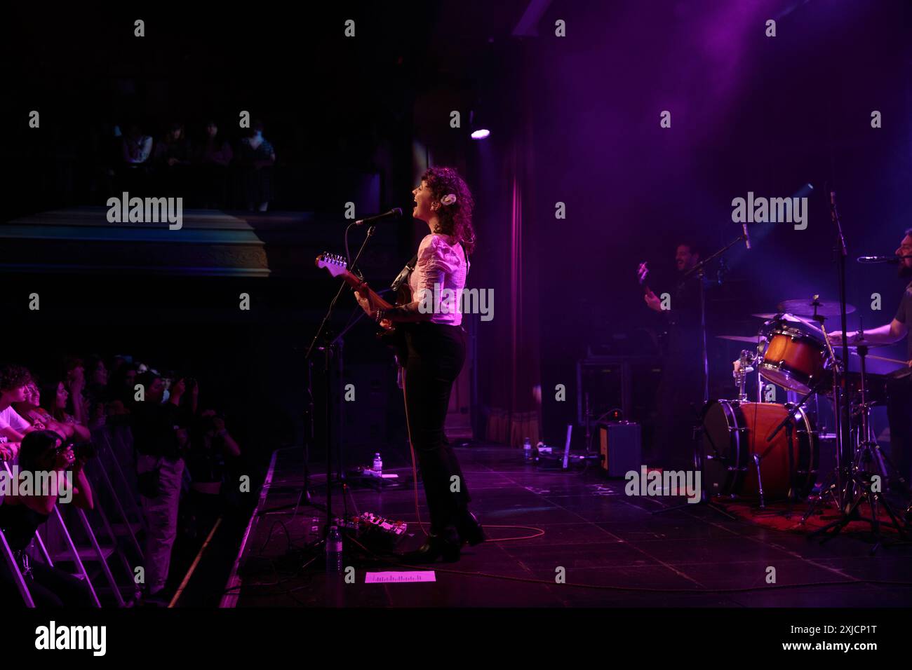 Kate Pillsbury of The Crane Wives plays guitar and sings live on stage ...
