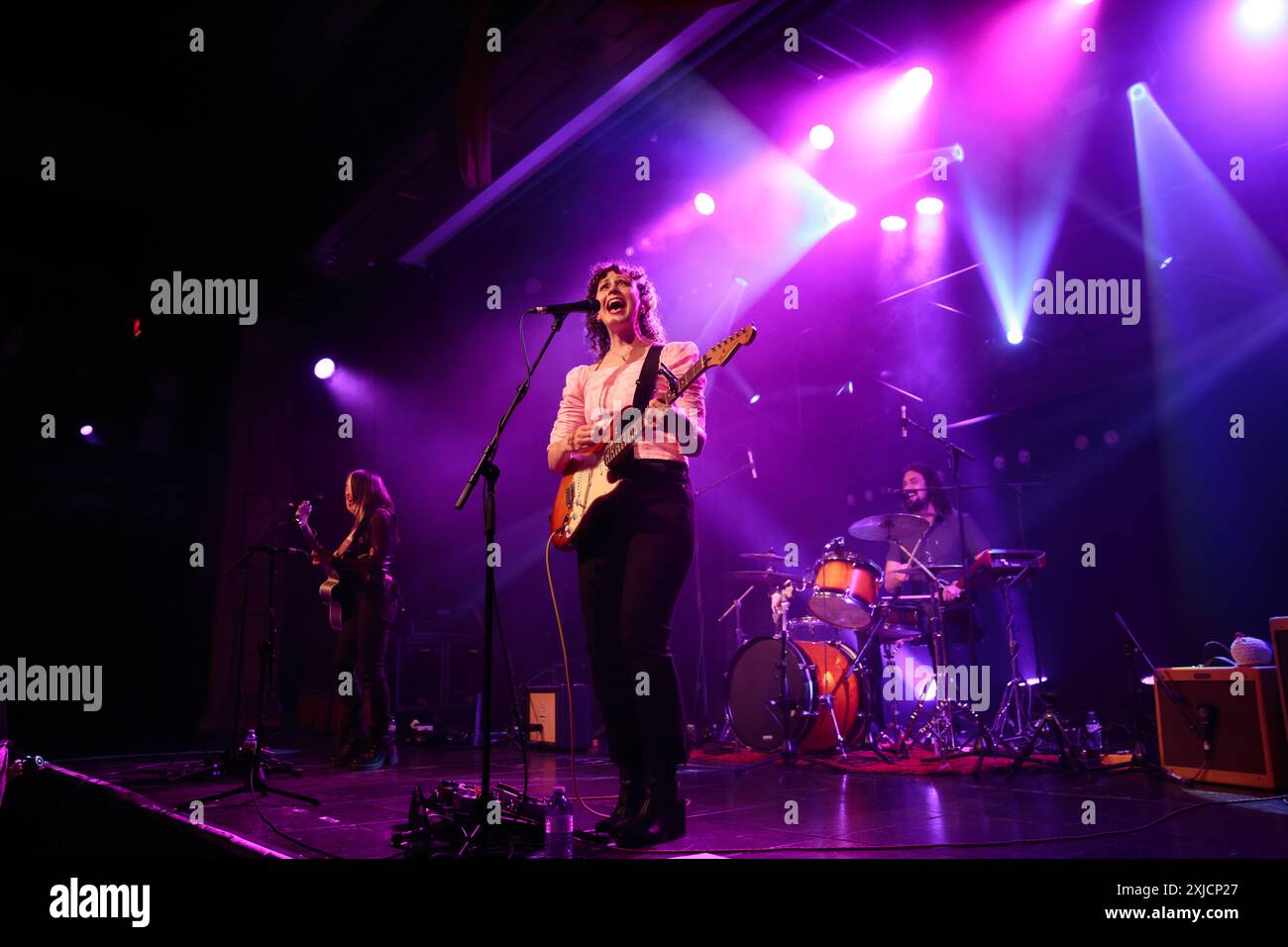 Kate Pillsbury of The Crane Wives plays guitar and sings live on stage ...