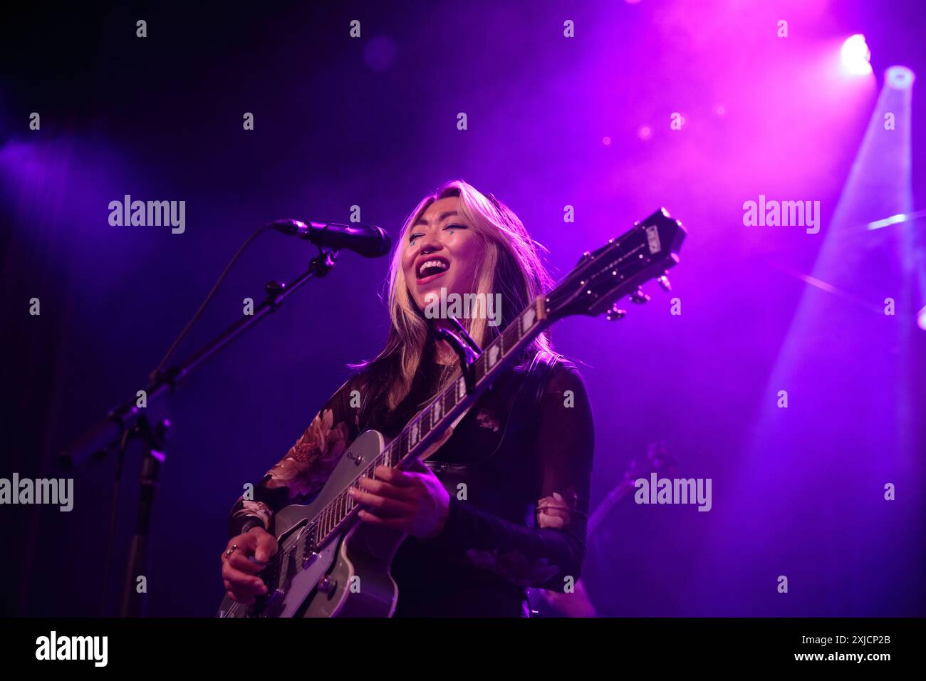 Kate Pillsbury of The Crane Wives plays guitar and sings live on stage ...