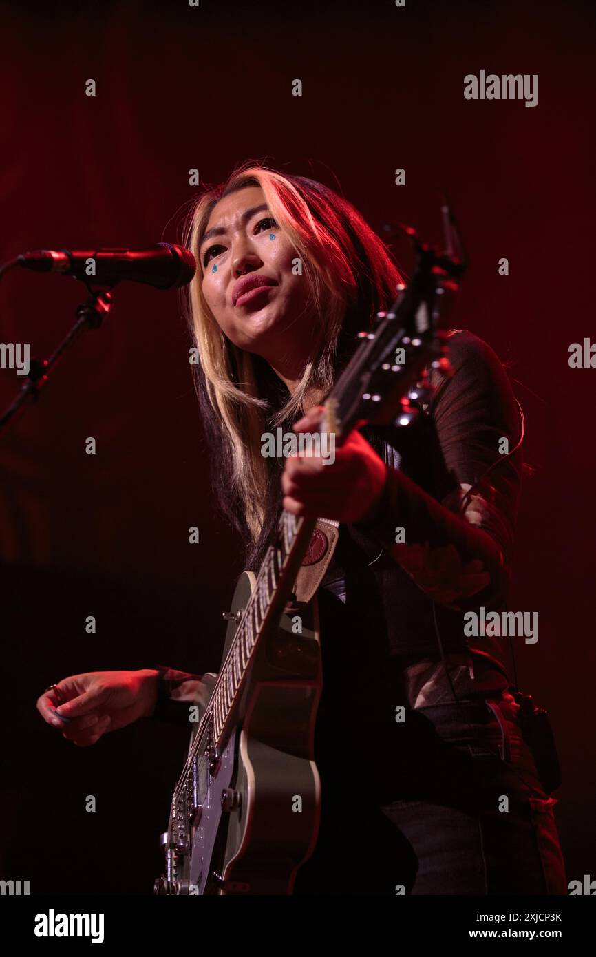 Kate Pillsbury of The Crane Wives plays guitar and sings live on stage ...