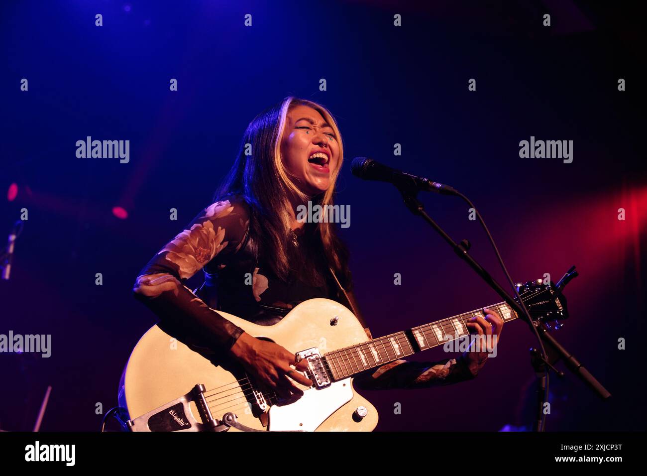 Kate Pillsbury of The Crane Wives plays guitar and sings live on stage ...