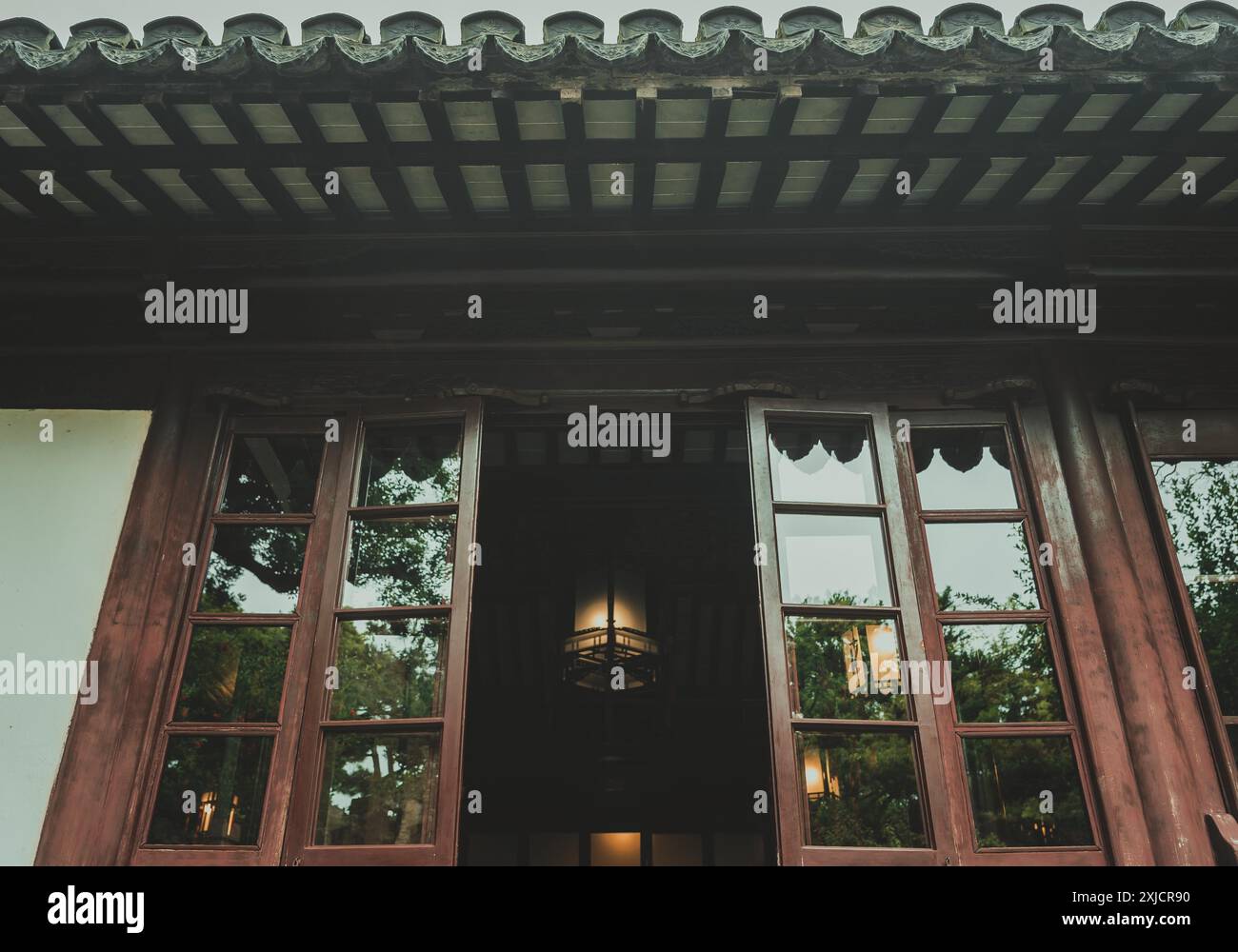 A low-angle view of a wooden window in a traditional Chinese building ...