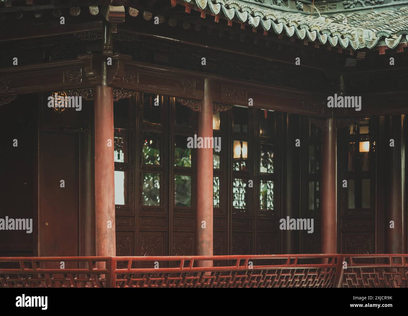 A close-up view of a traditional Chinese wooden structure with carved ...