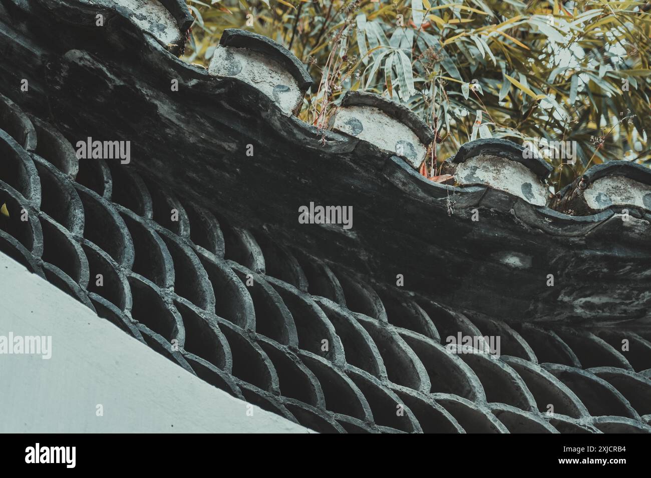 A close-up of an intricate pattern of rounded bricks in a wall at the ...
