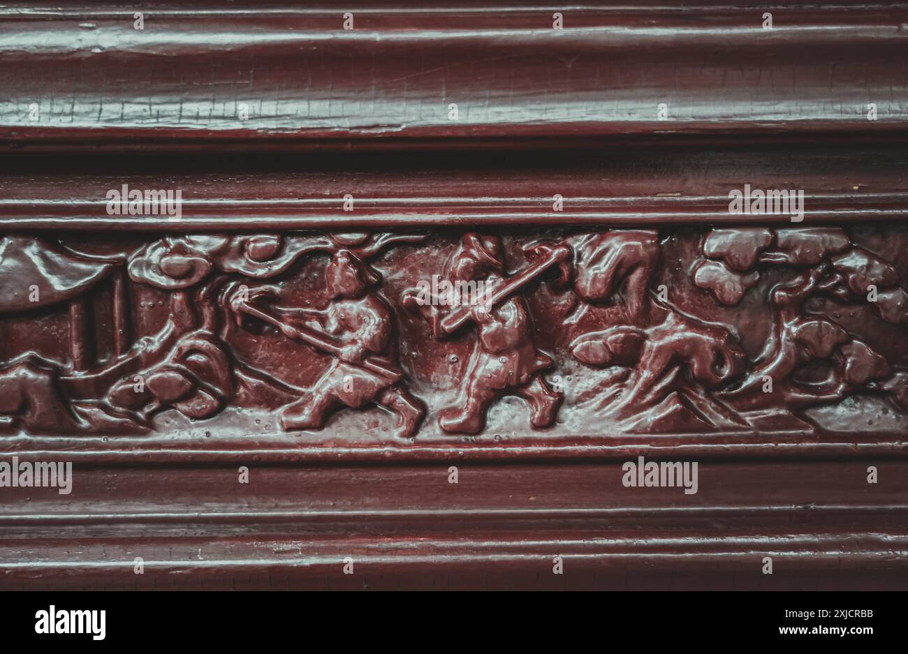 Intricate carved wood design with figures in a relief on the exterior ...