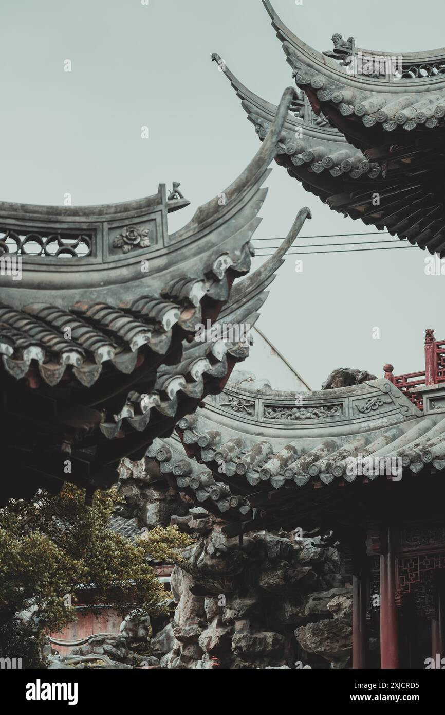 Close-up of ornate gray roof tiles on a traditional Chinese building ...