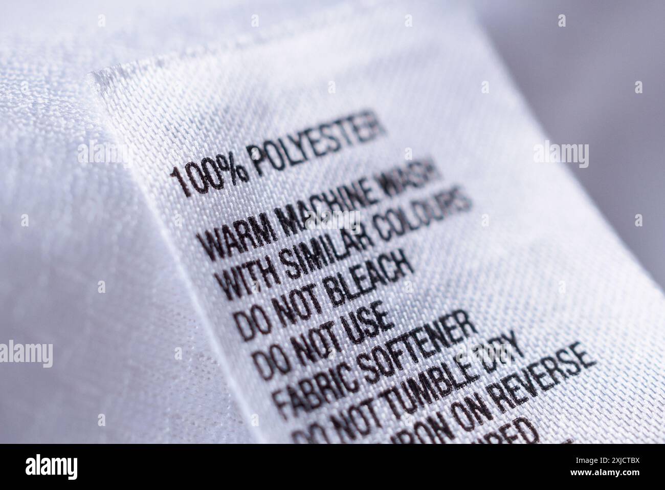 Polyester fabric Clothing label with laundry instructions Stock Photo ...
