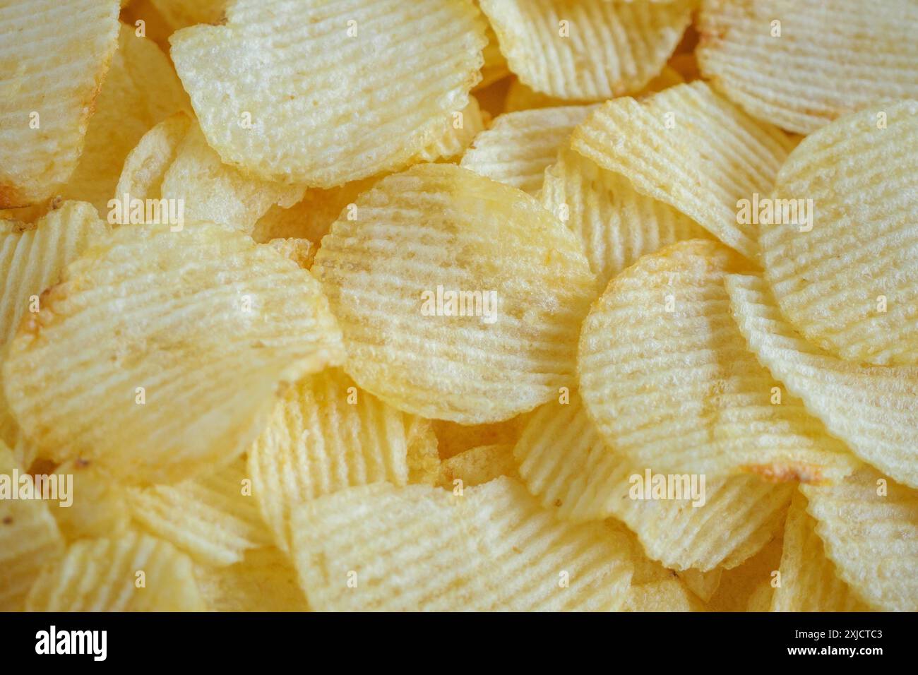 crispy potato chips snack texture background Stock Photo - Alamy
