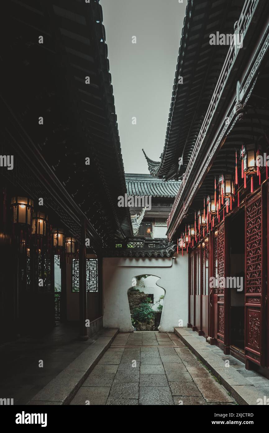 Shanghai, China - June 06, 2024 : A stone path winds through the Yu ...