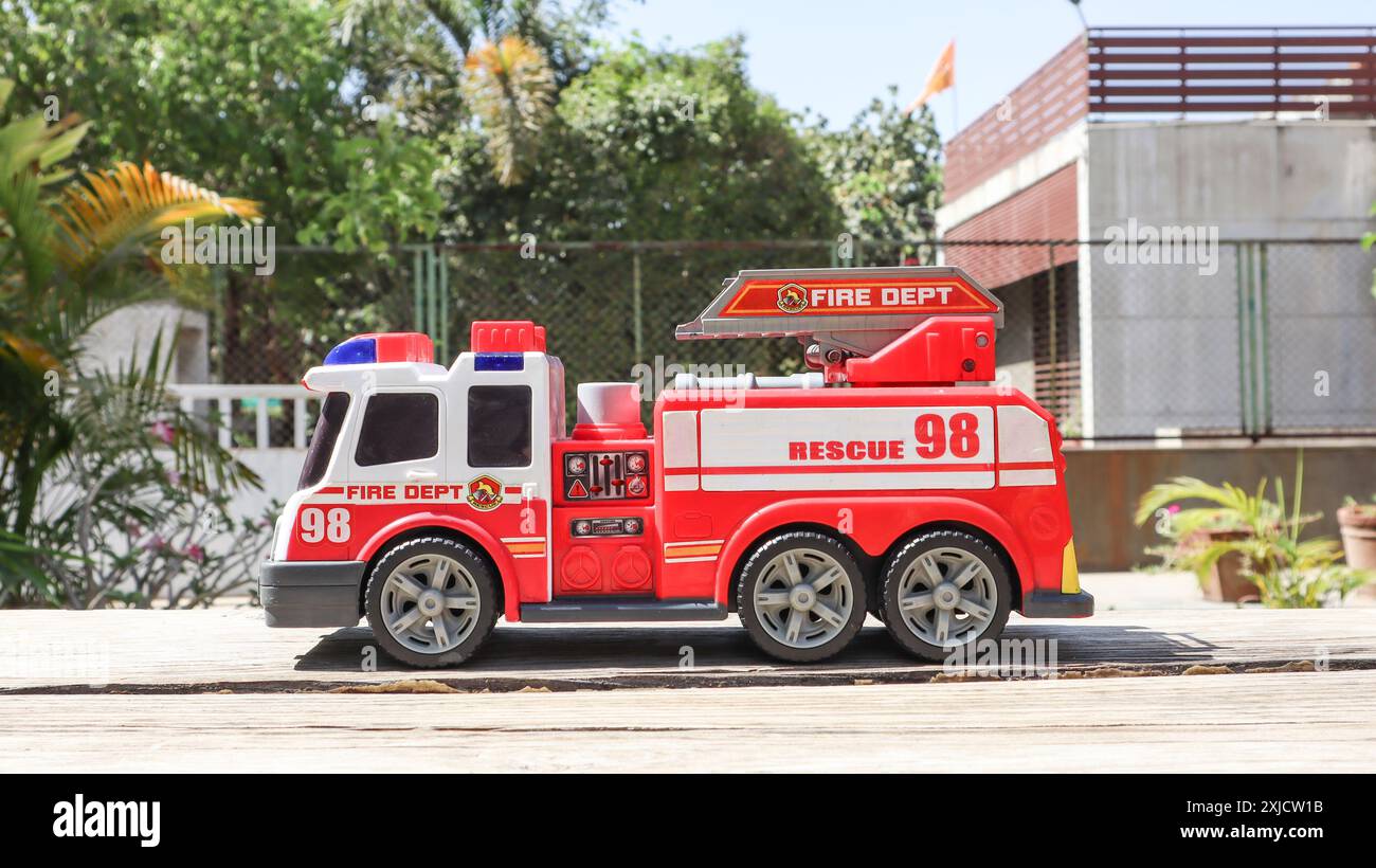 Red Toy Firetruck for playing. Toy fire brigade truck vehicle outdoor ...