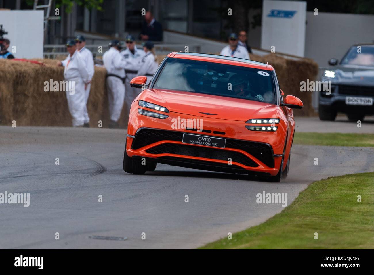 2024 Genesis GV60 Magma Concept car driving up the hill climb track at ...