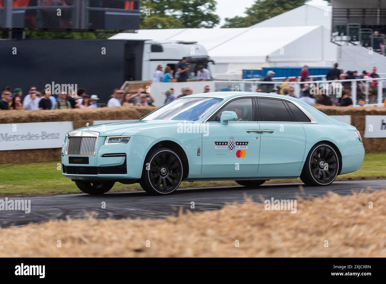 Rolls-Royce Ghost luxury car driving up the hill climb track at the ...