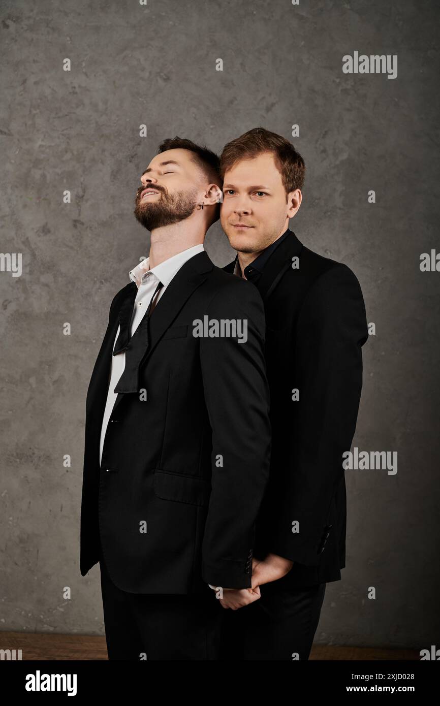 Men in gray suits hi-res stock photography and images - Alamy