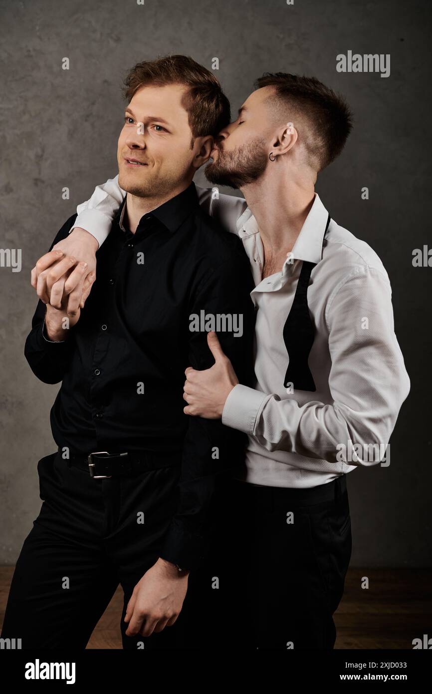 Two men in suits share a tender moment Stock Photo - Alamy