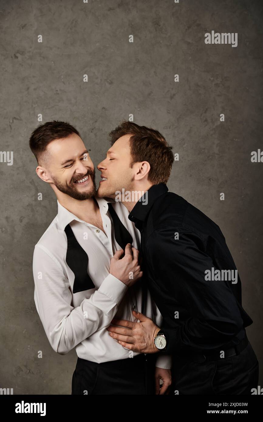 Two gay men holding other hi-res stock photography and images - Alamy