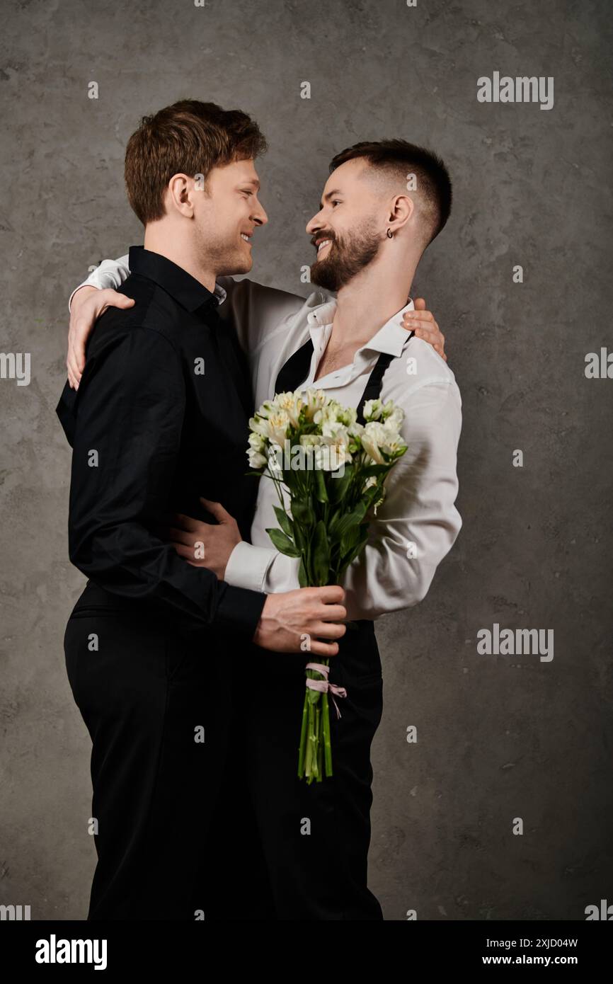 Two men in suits embrace, one holding flowers, gazing lovingly Stock ...