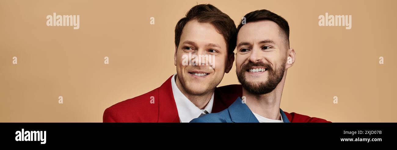 Two smiling men in elegant suits pose for a photo Stock Photo - Alamy