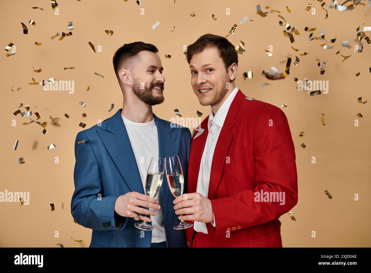 Two men in suits celebrate with champagne and confetti Stock Photo - Alamy