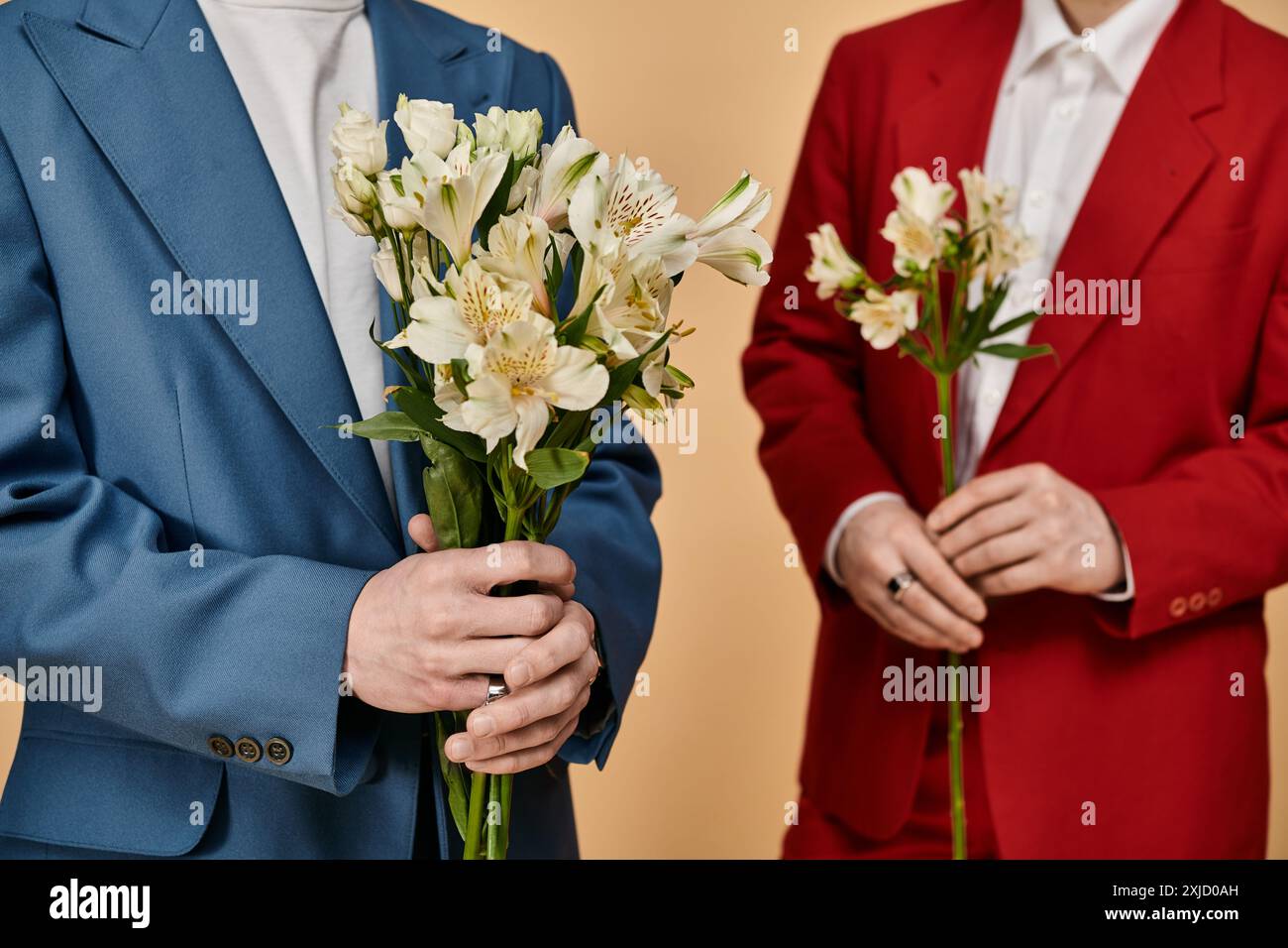 Two men in suits hold bouquets of flowers Stock Photo - Alamy