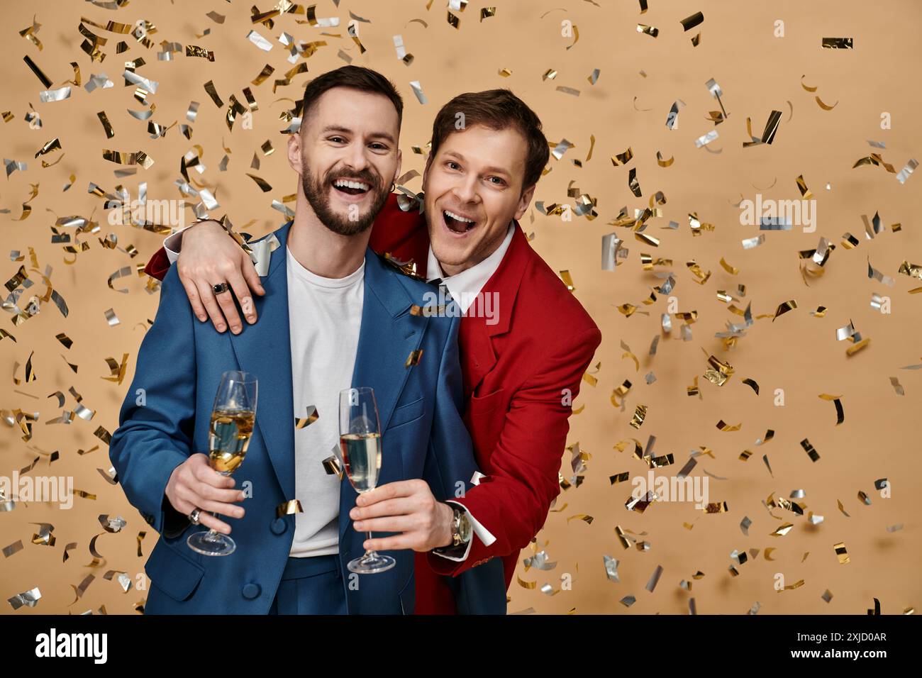 Two men in elegant suits celebrate with champagne and confetti Stock ...