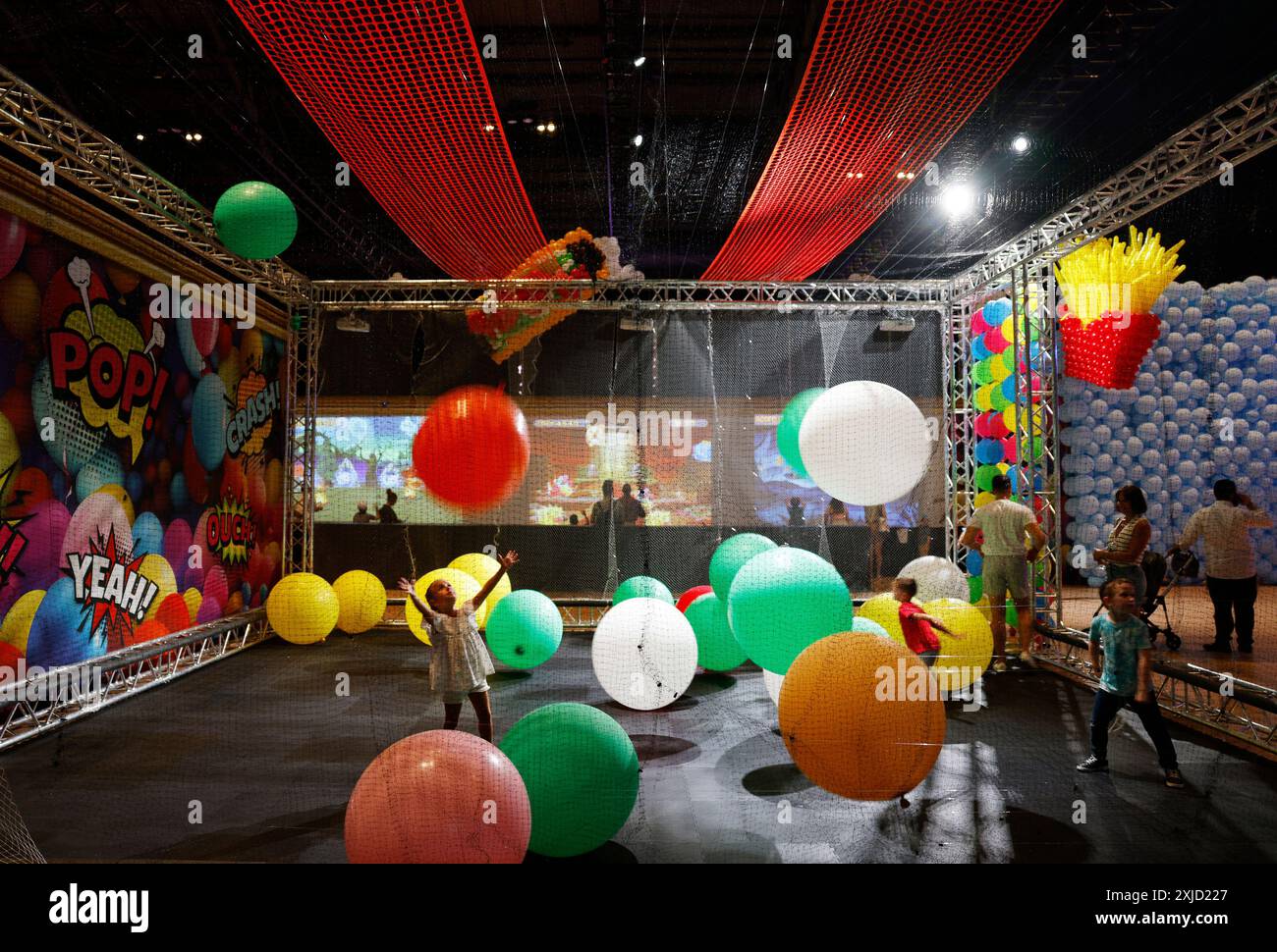 New York, United States. 17th July, 2024. Children play in a balloon ...