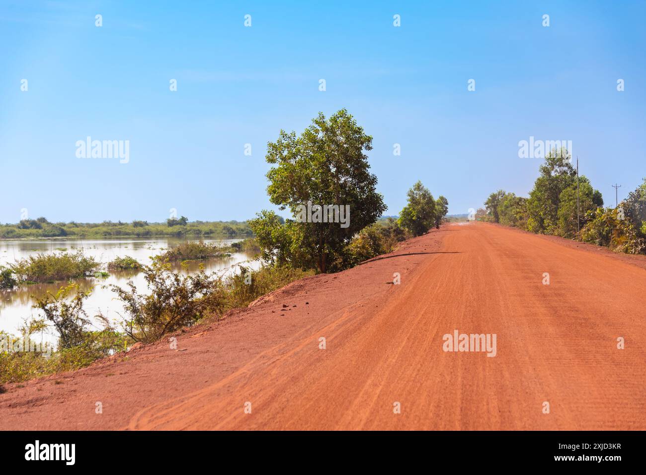 Rural unpaved road of red sand in Cambodia Stock Photo - Alamy