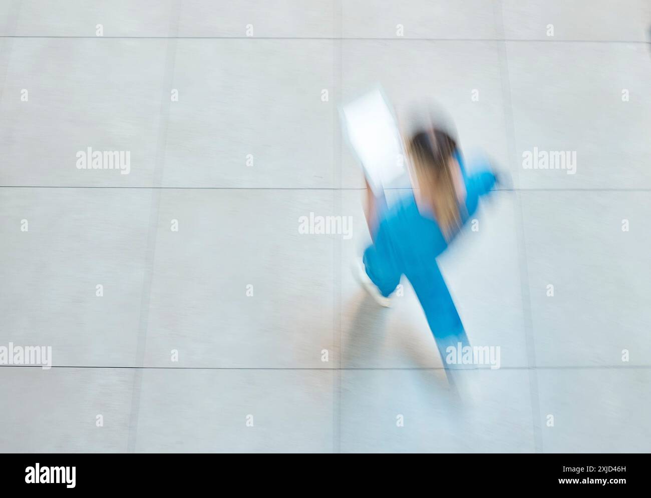 Nurse, blur and walking or rushing in hospital for patient emergency ...