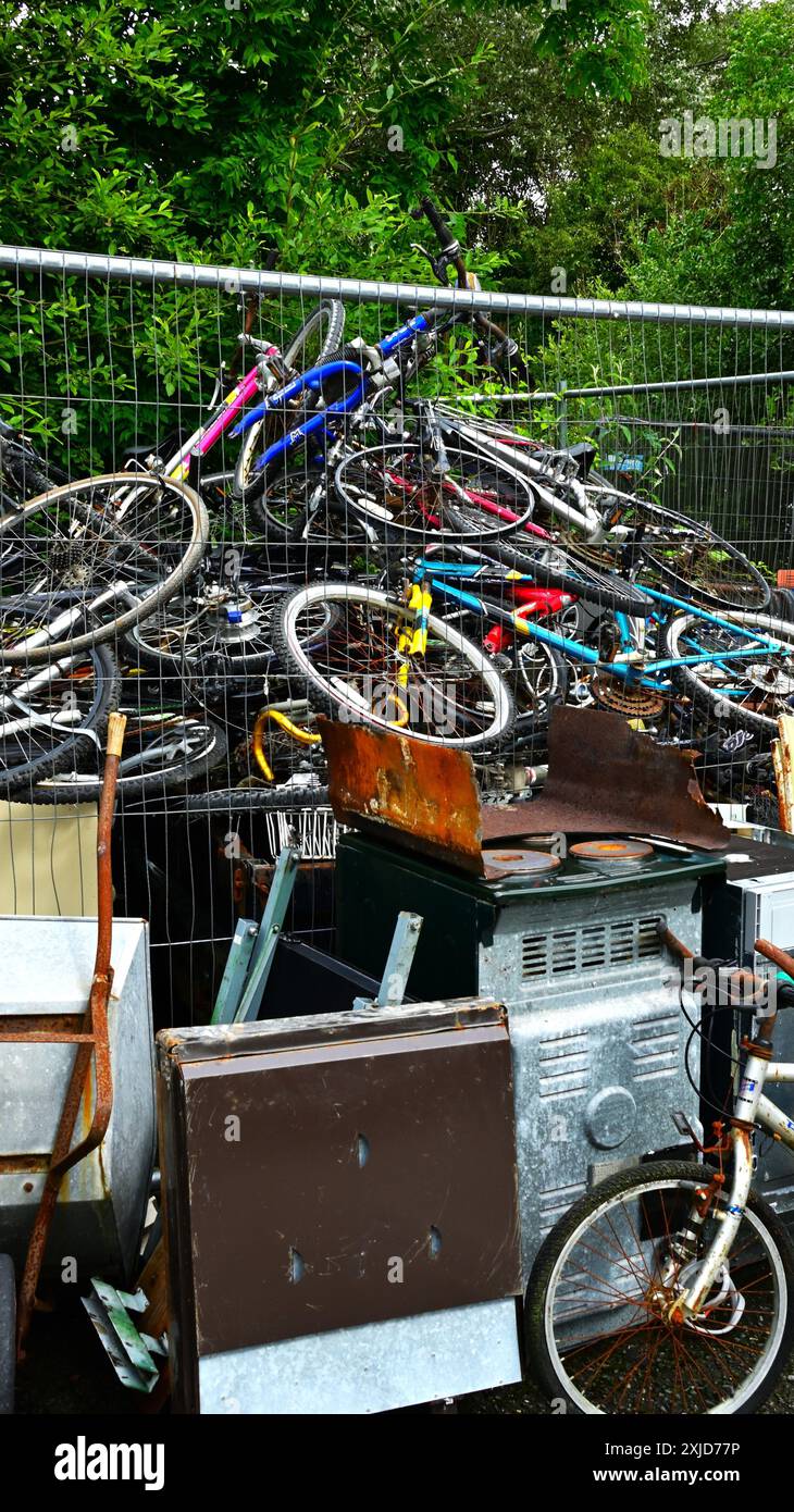 piles of cycles/bikes ready for recycling, including tyres, wheels and ...