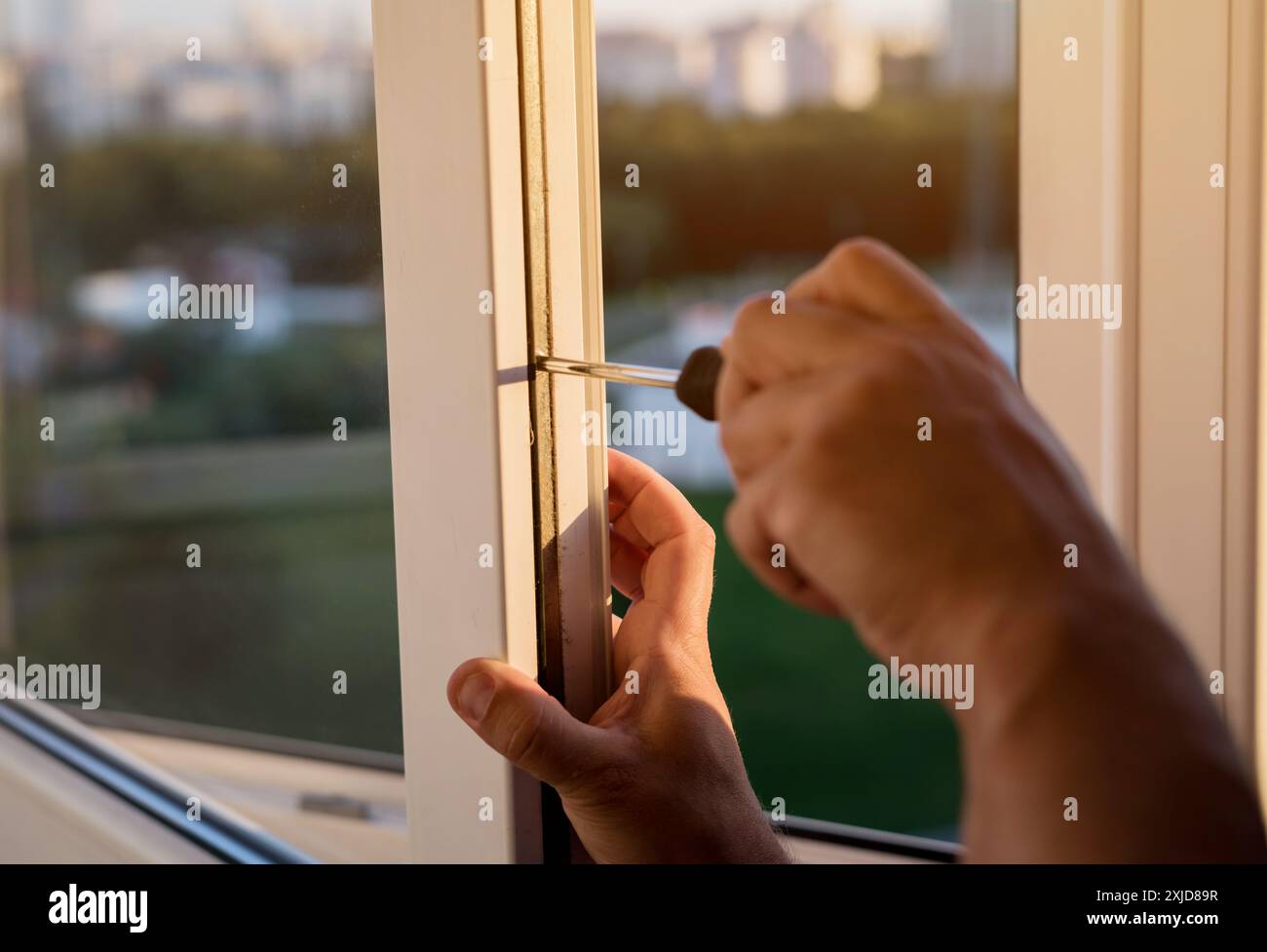 adjustment of windows by the craftsman from the window specialist Stock ...