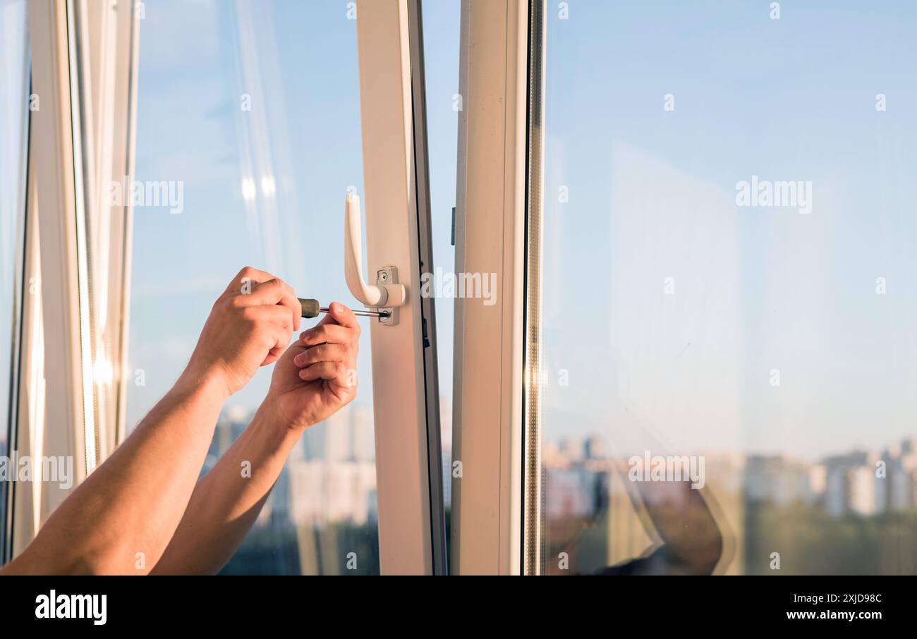 Hands working screwdriver adjust hi-res stock photography and images ...