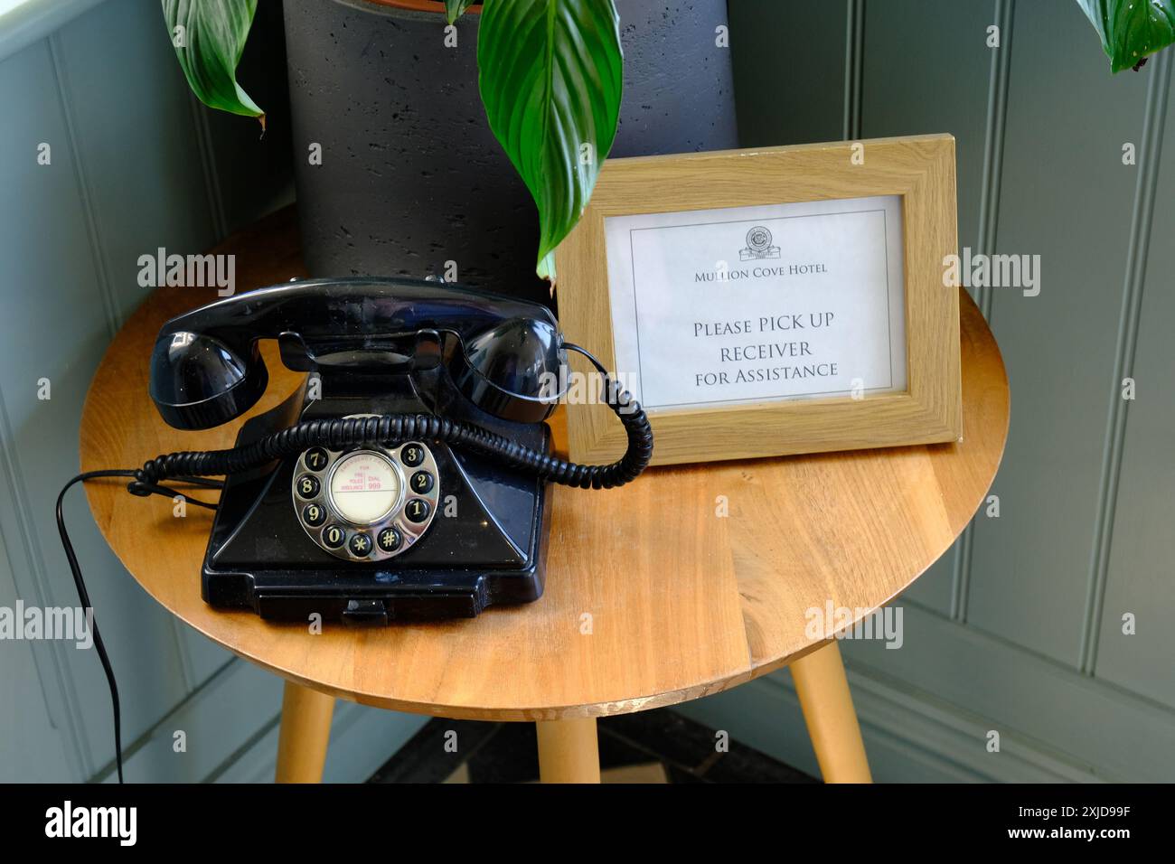 Old-fashioned bakelite telephone in a hotel lobby - John Gollop Stock ...