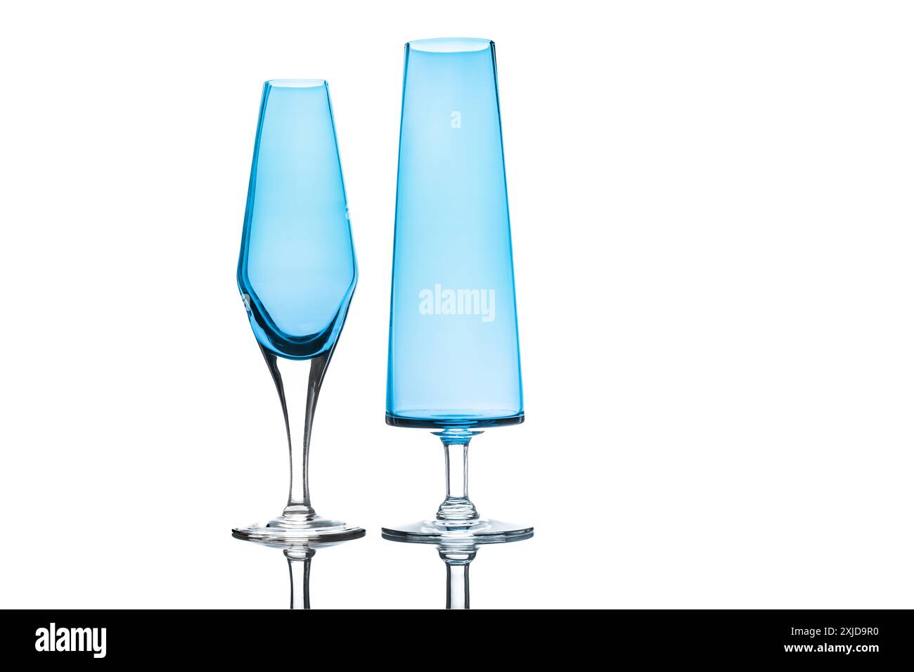 Tall Light Blue Drinking Glasses Stand Against A Clean White Background The Base And Part Of