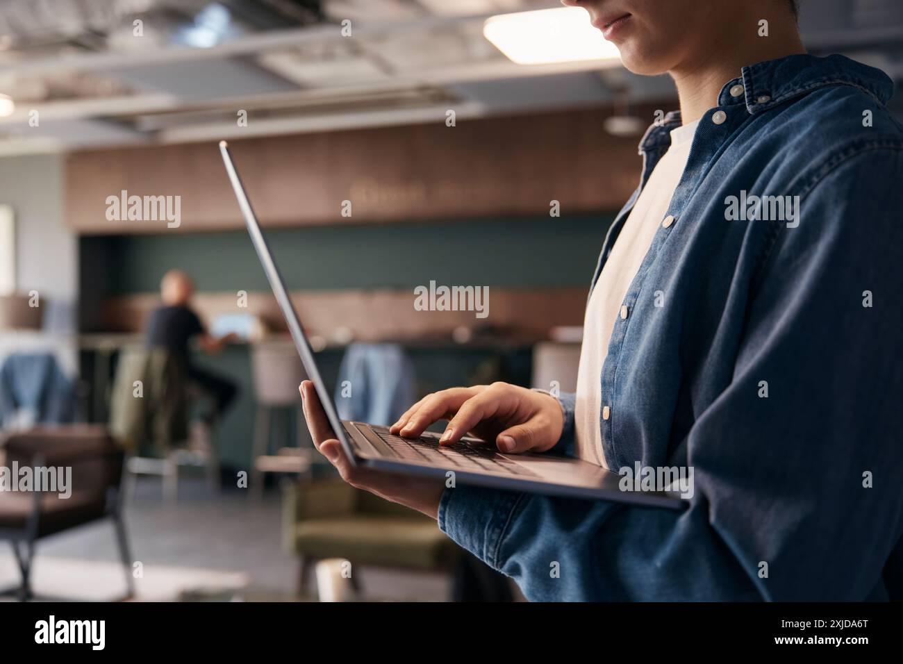 Office professional holding laptop hi-res stock photography and images ...