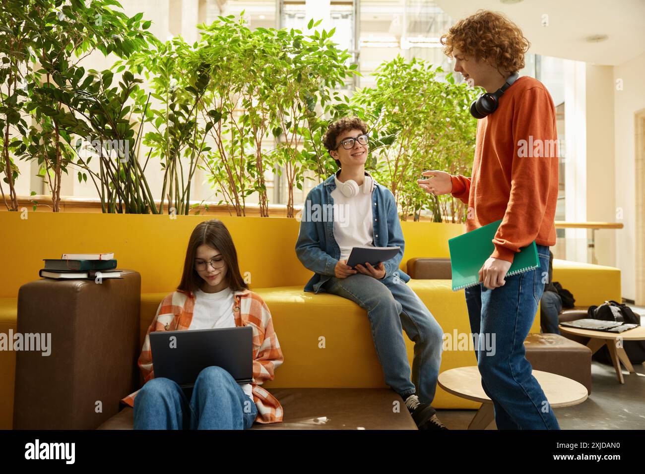 Group of teenagers in coworking office Stock Photo - Alamy