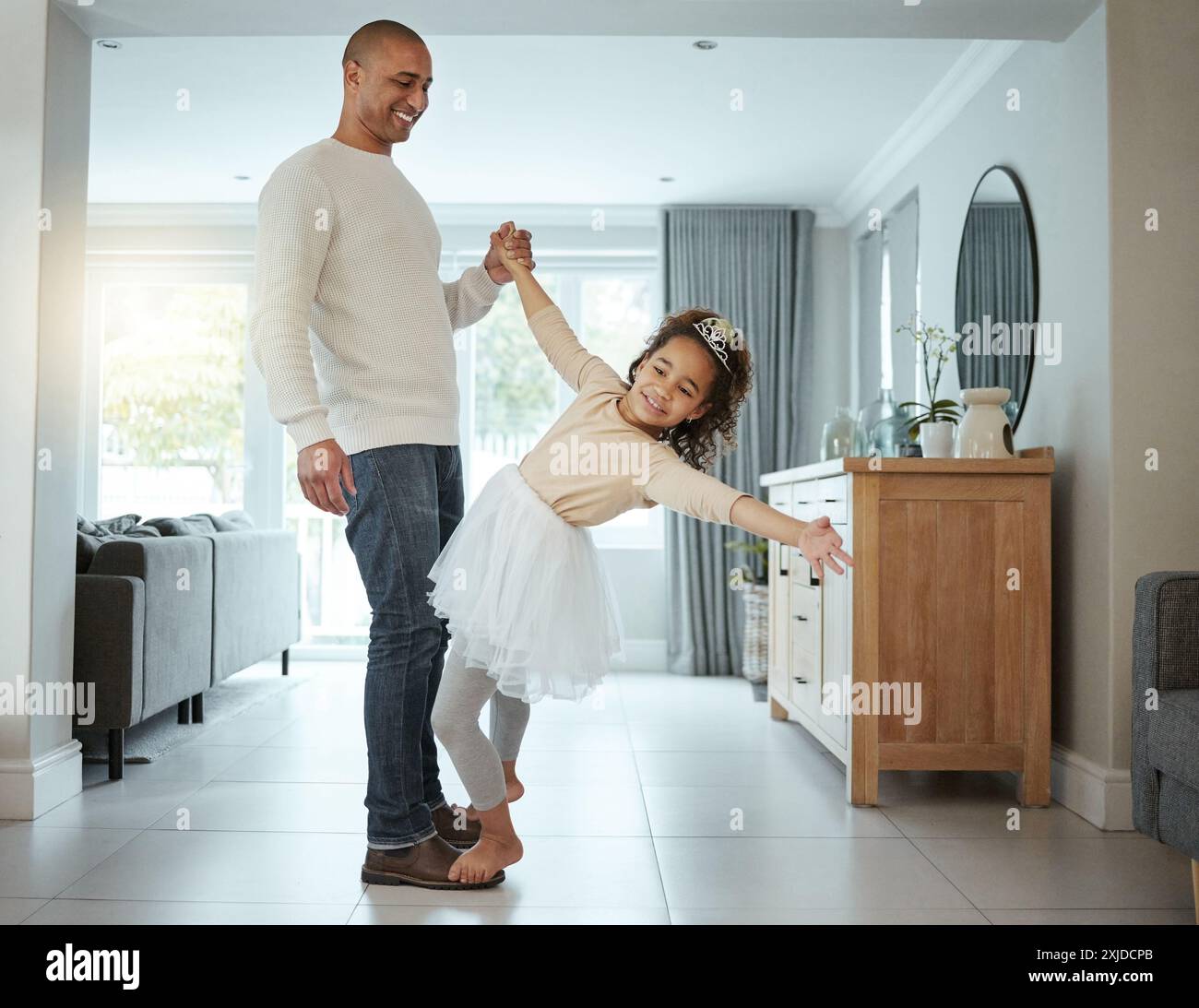 Girl, father and happy in home with dancing on feet for support ...