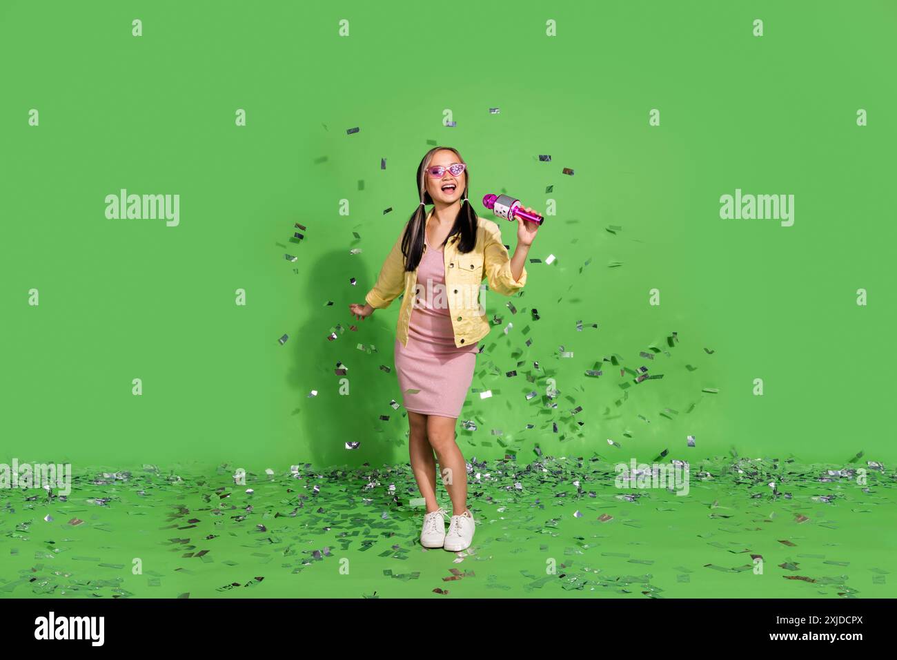 Full size photo of nice young girl sing microphone confetti wear jacket ...