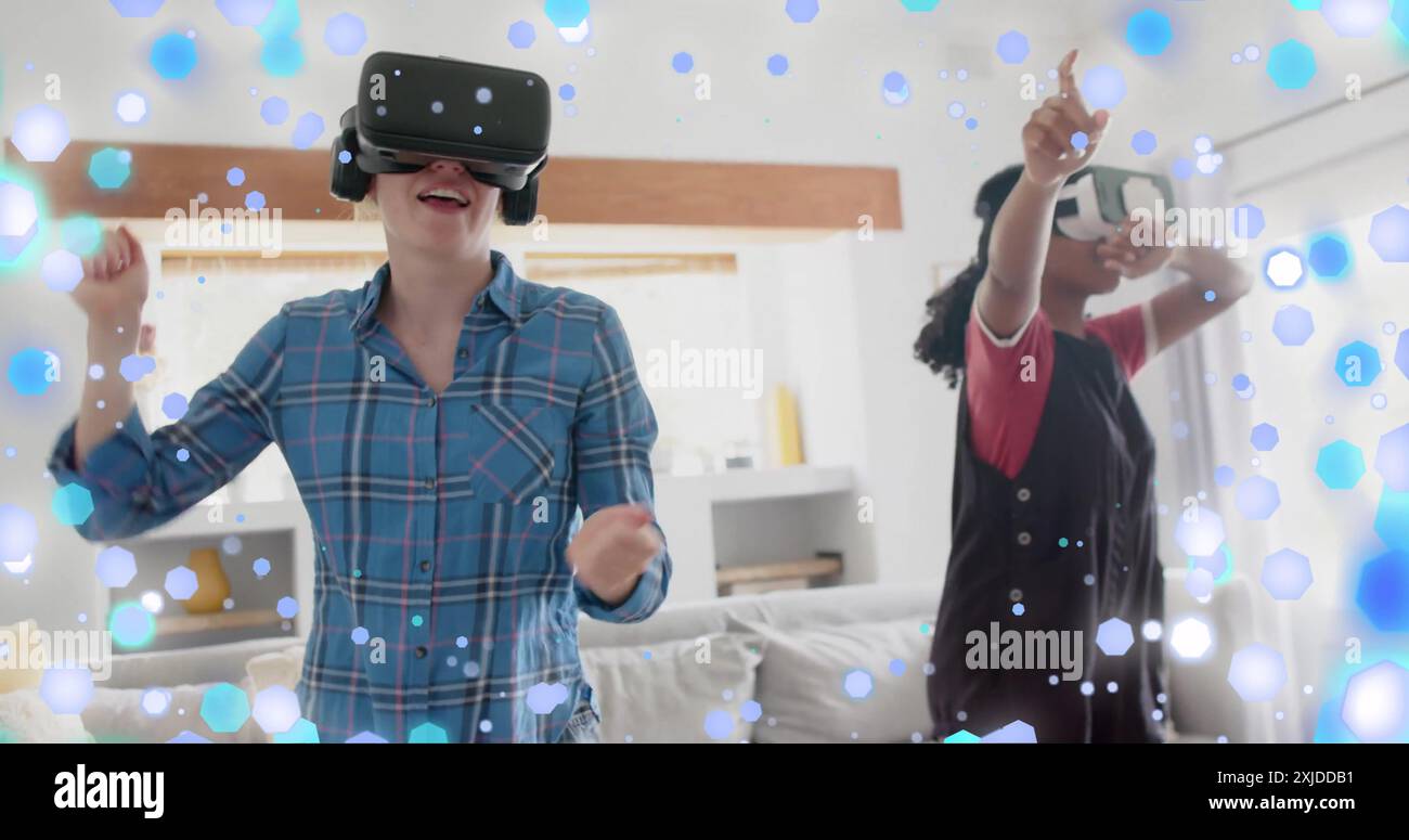 Image of blue and white spots over two happy diverse teenage girls in ...
