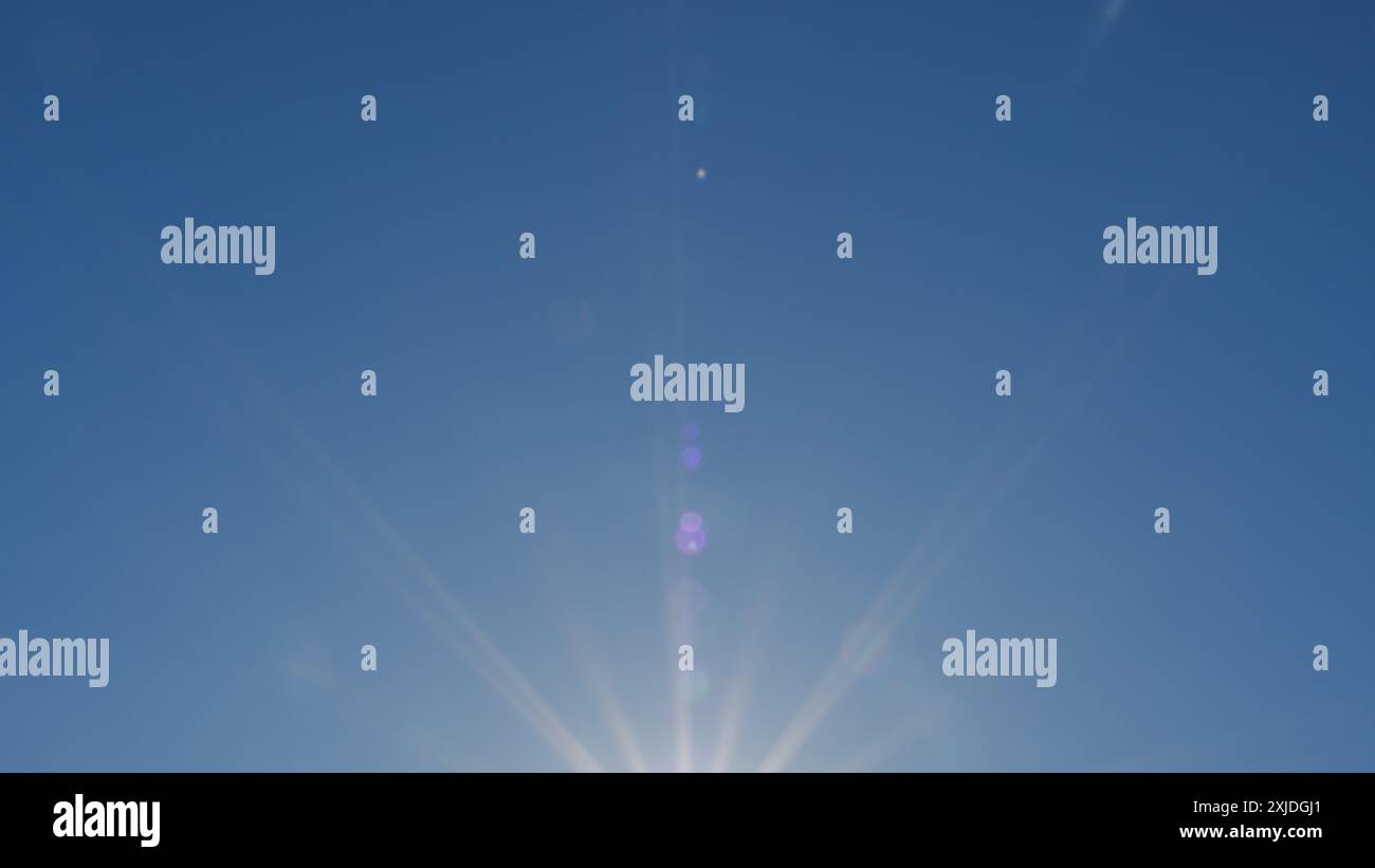 Close Up. Sun Shining Bright In Clear Blue Sky. Solar Energy Power ...